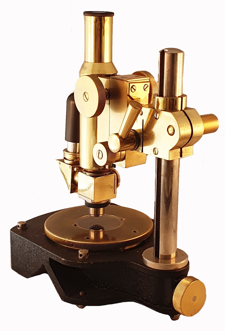 A gold and black microscopeDescription automatically generated