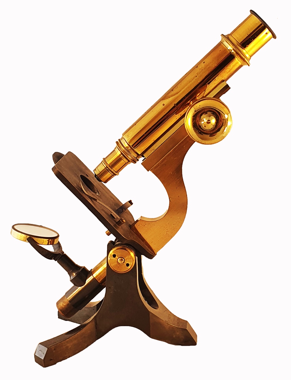 A close-up of a gold microscopeDescription automatically generated