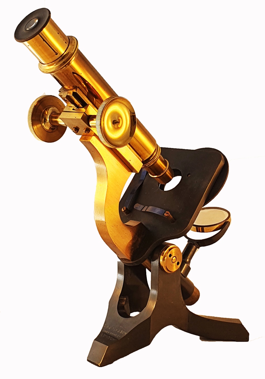 A close-up of a gold microscopeDescription automatically generated